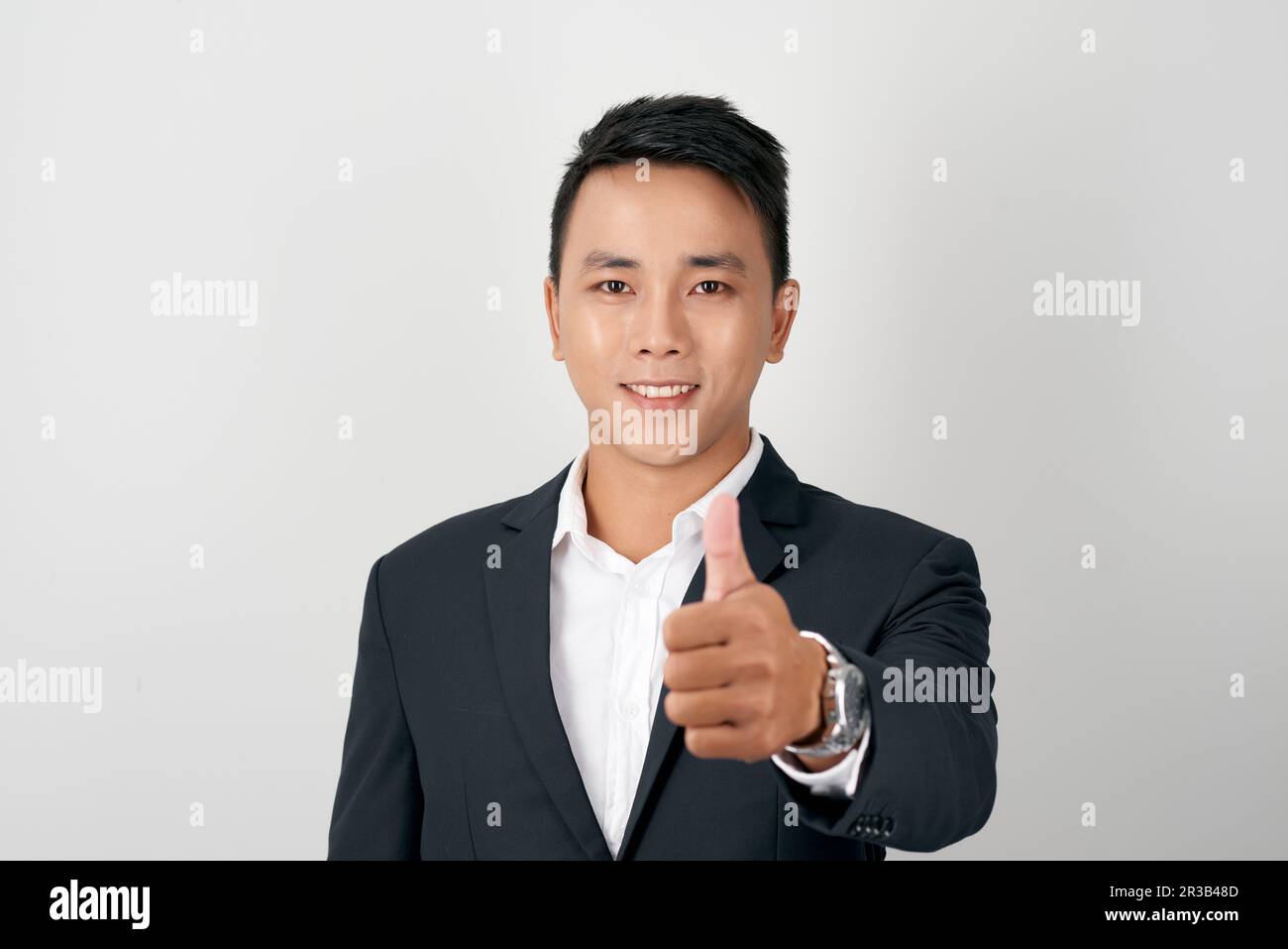 Happy Asian man shows thumb up for success concept Stock Photo - Alamy