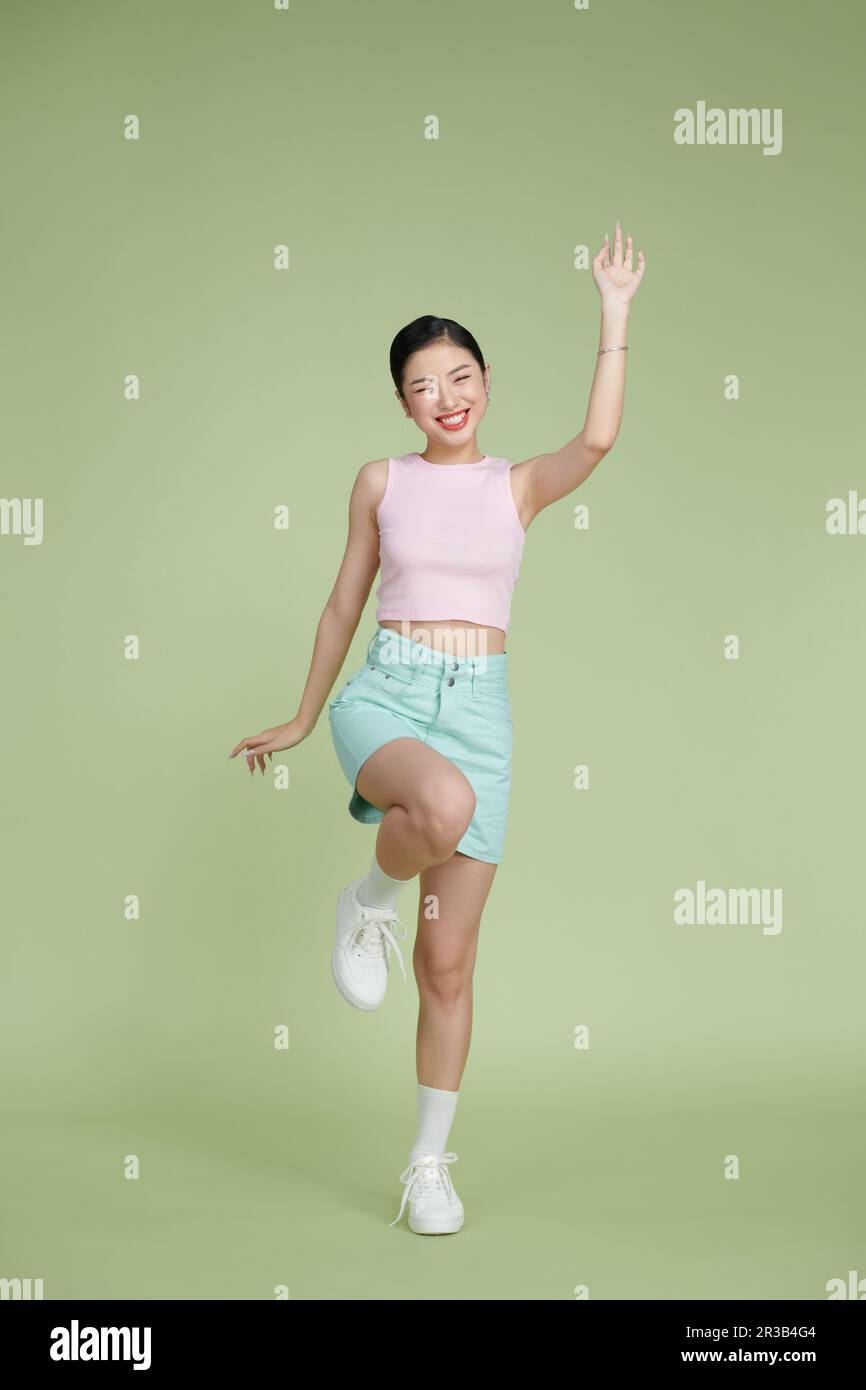 Lovely slim girl posing with sincere smile Stock Photo - Alamy