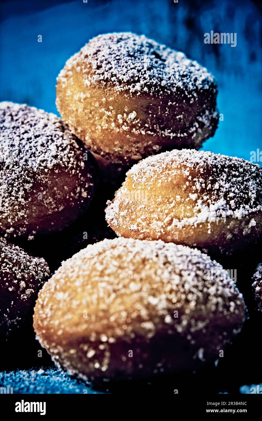 Mini doughnuts dusted with icing sugar Stock Photo - Alamy