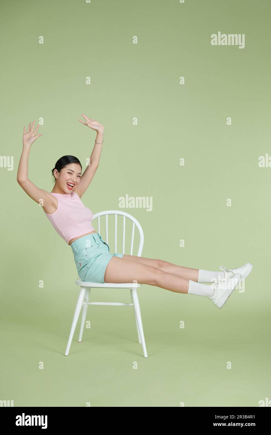 Sitting student hands raised chair hi-res stock photography and images ...