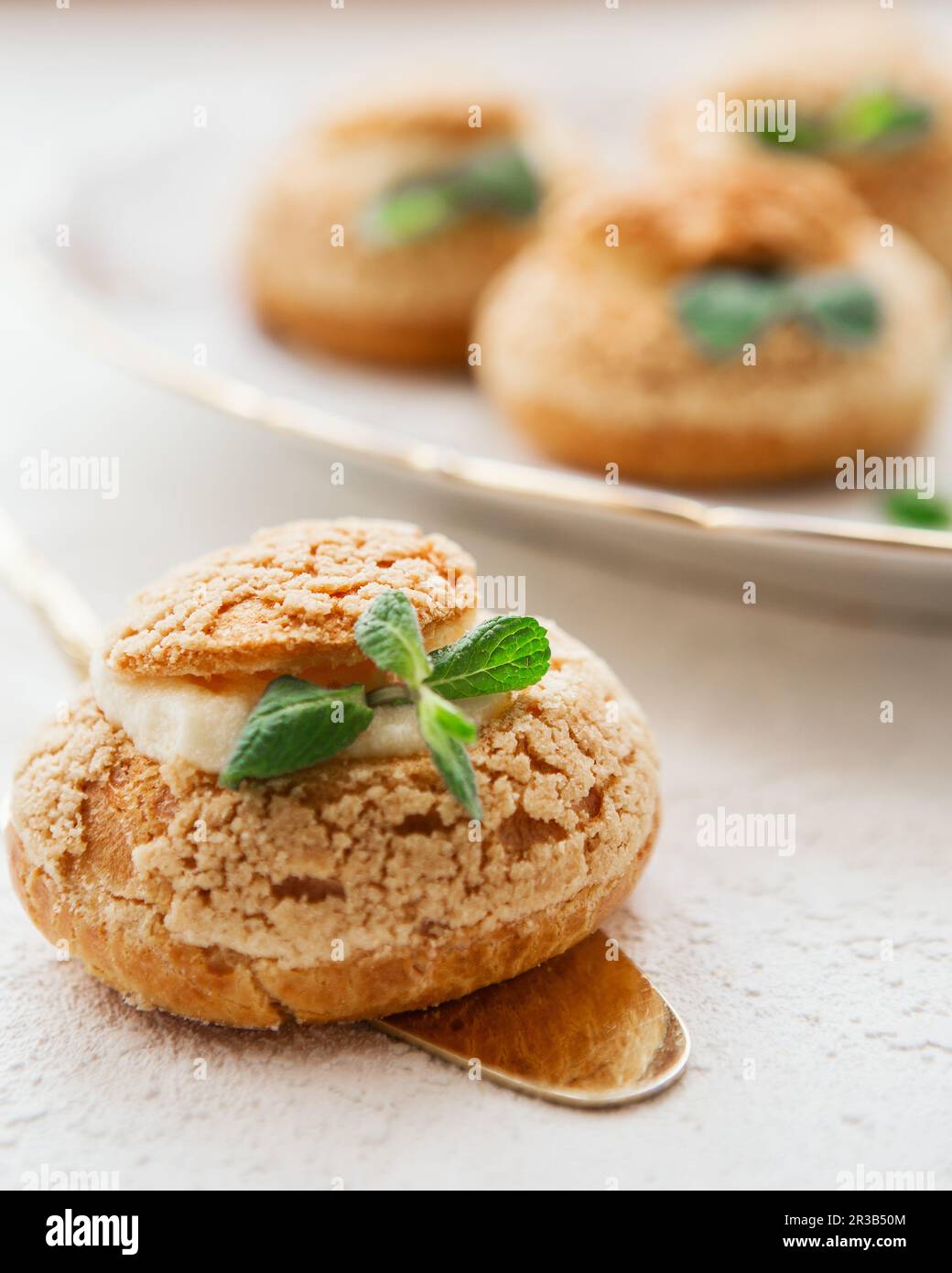 Homemade profiteroles on the music sheet with notes. Profiteroles ...