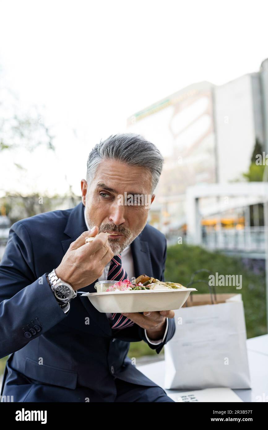 Hungry businessman hi-res stock photography and images - Alamy