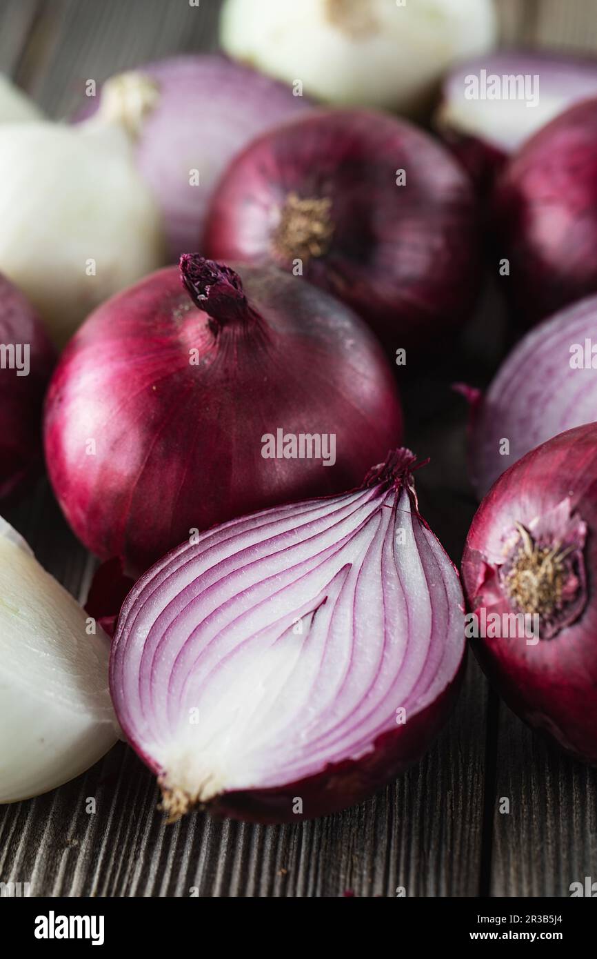 Red onions on rustic wood or on dark background. Red onion halves. Food ...