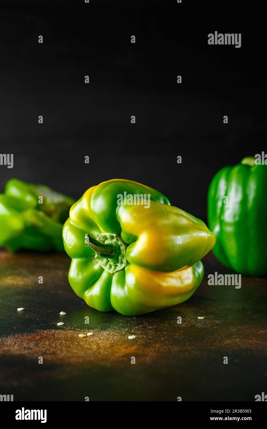 Sweet green pepper on dark background. Fresh yellow green bell pepper ...