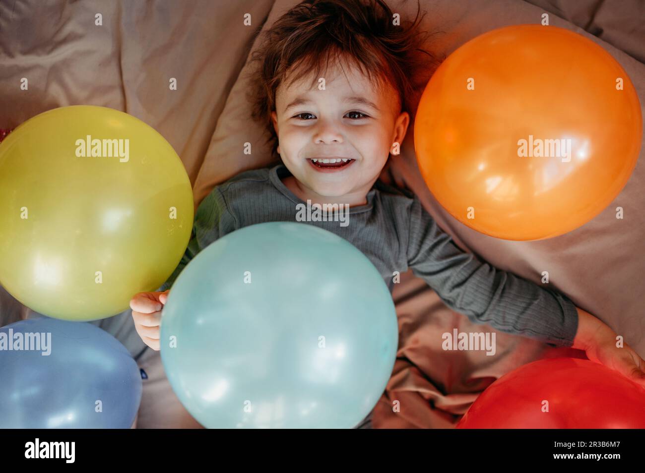 Happy boy with balloons hi-res stock photography and images - Alamy