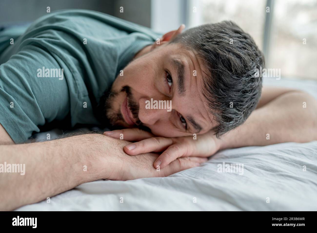 Man relaxing in bed hi-res stock photography and images - Alamy