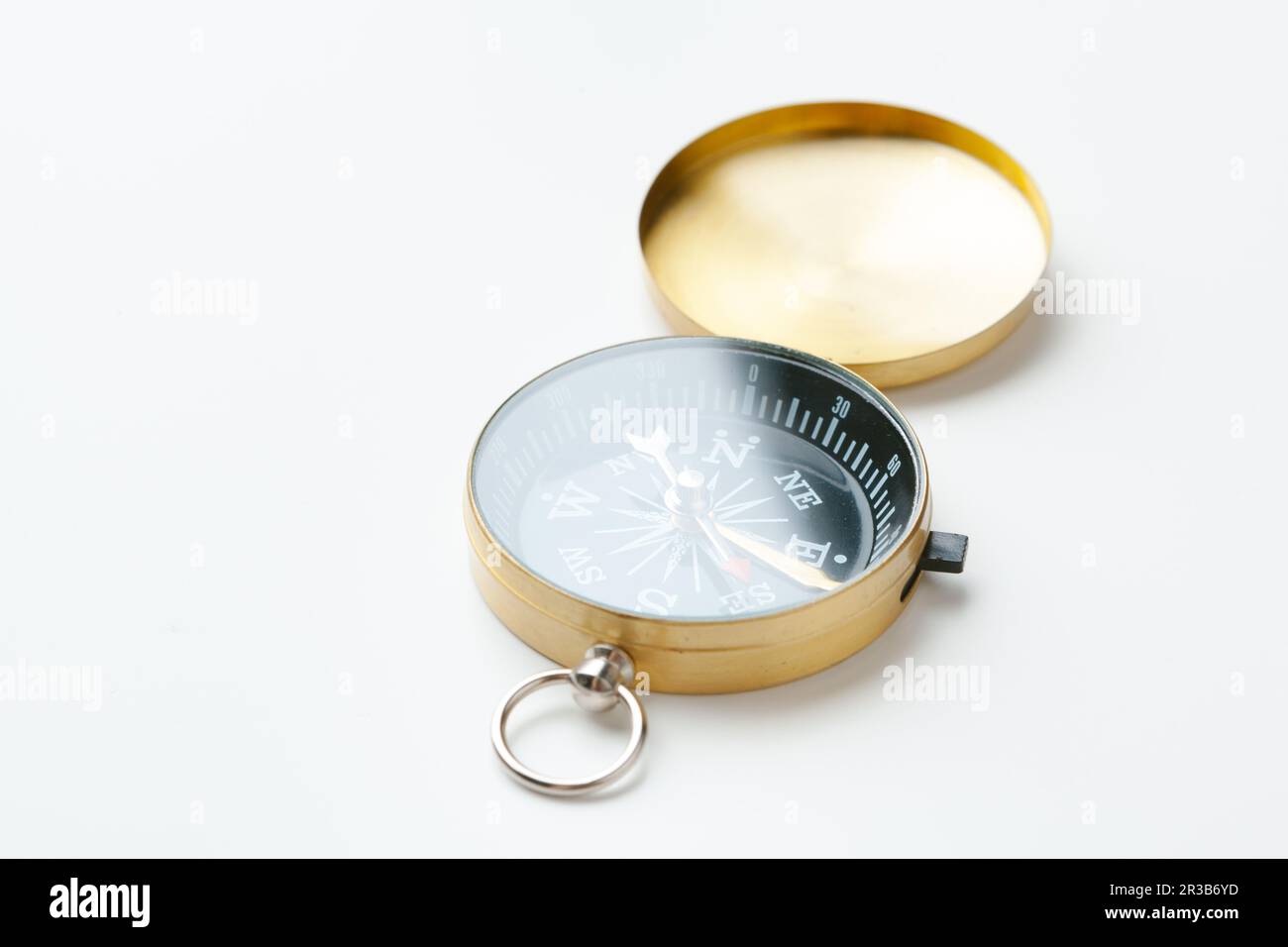 Golden vintage compass isolated on white background Stock Photo - Alamy