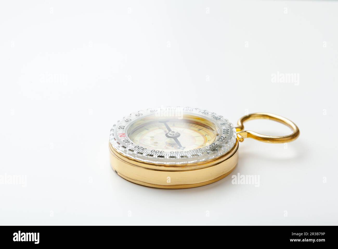 Antique golden compass isolated on white background Stock Photo - Alamy