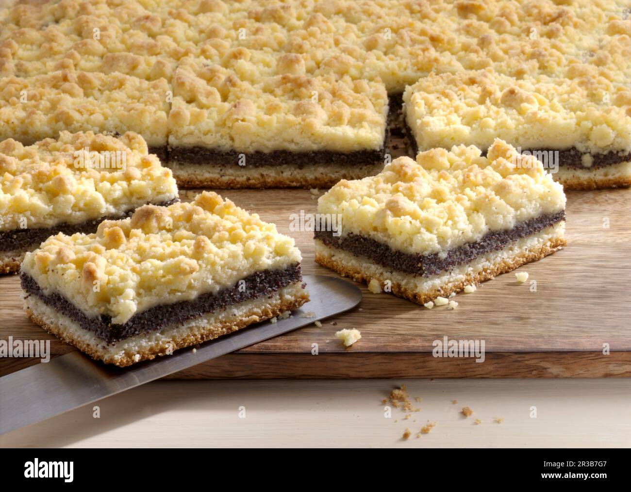 Poppy seed crumble cake, sliced Stock Photo - Alamy