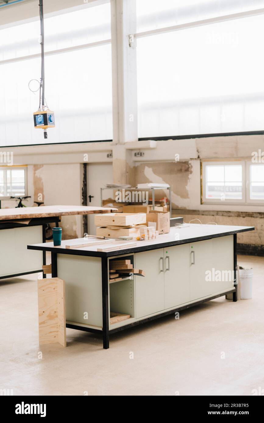 Wooden objects on workbench in carpentry factory Stock Photo - Alamy