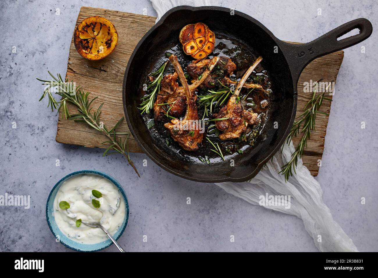 Roast lamb chops with rosemary and garlic Stock Photo - Alamy