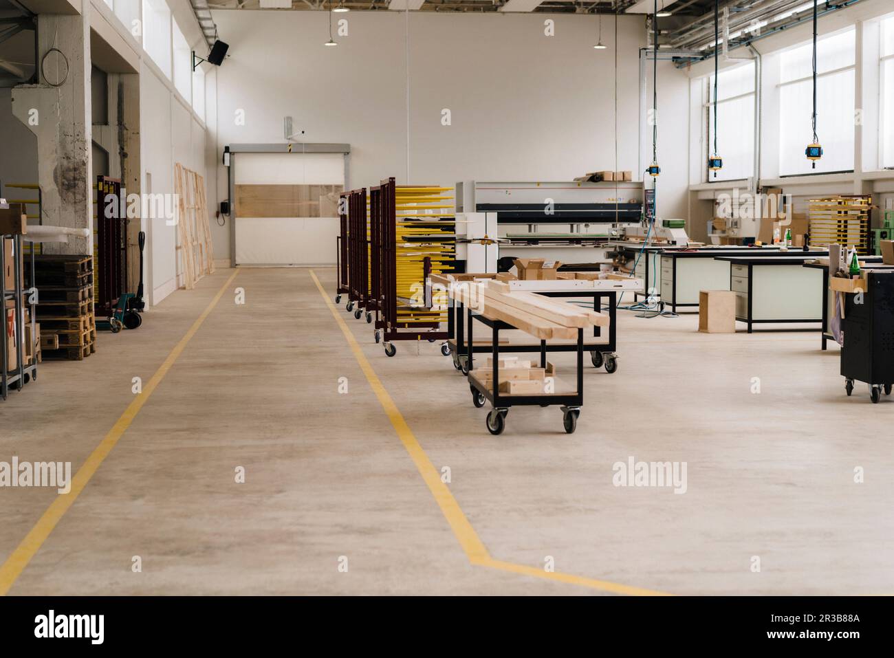 Planks on trolley in modern carpentry factory Stock Photo - Alamy