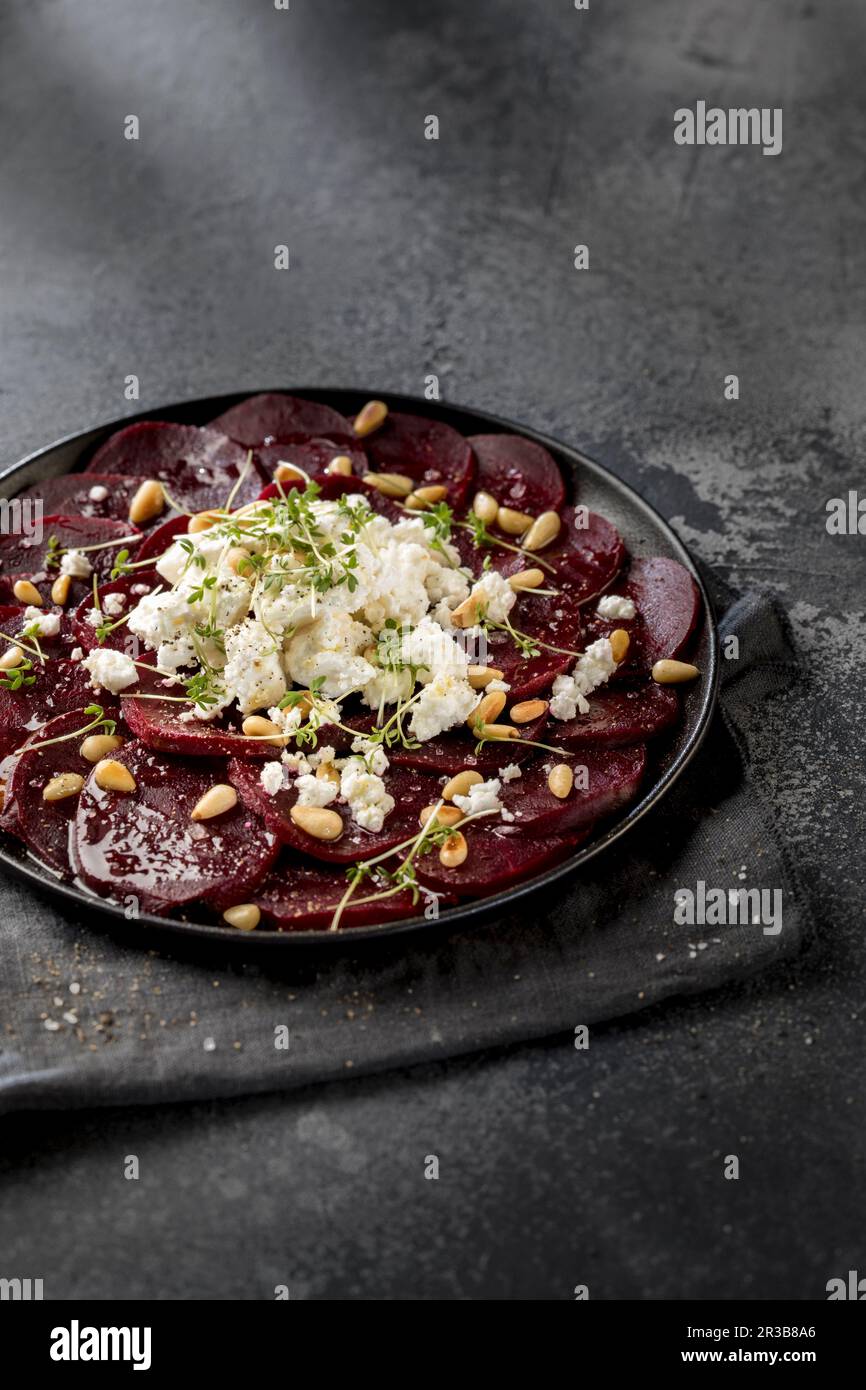 Beetroot with goat’s cheese, pine nuts, cress, olive oil, salt and ...