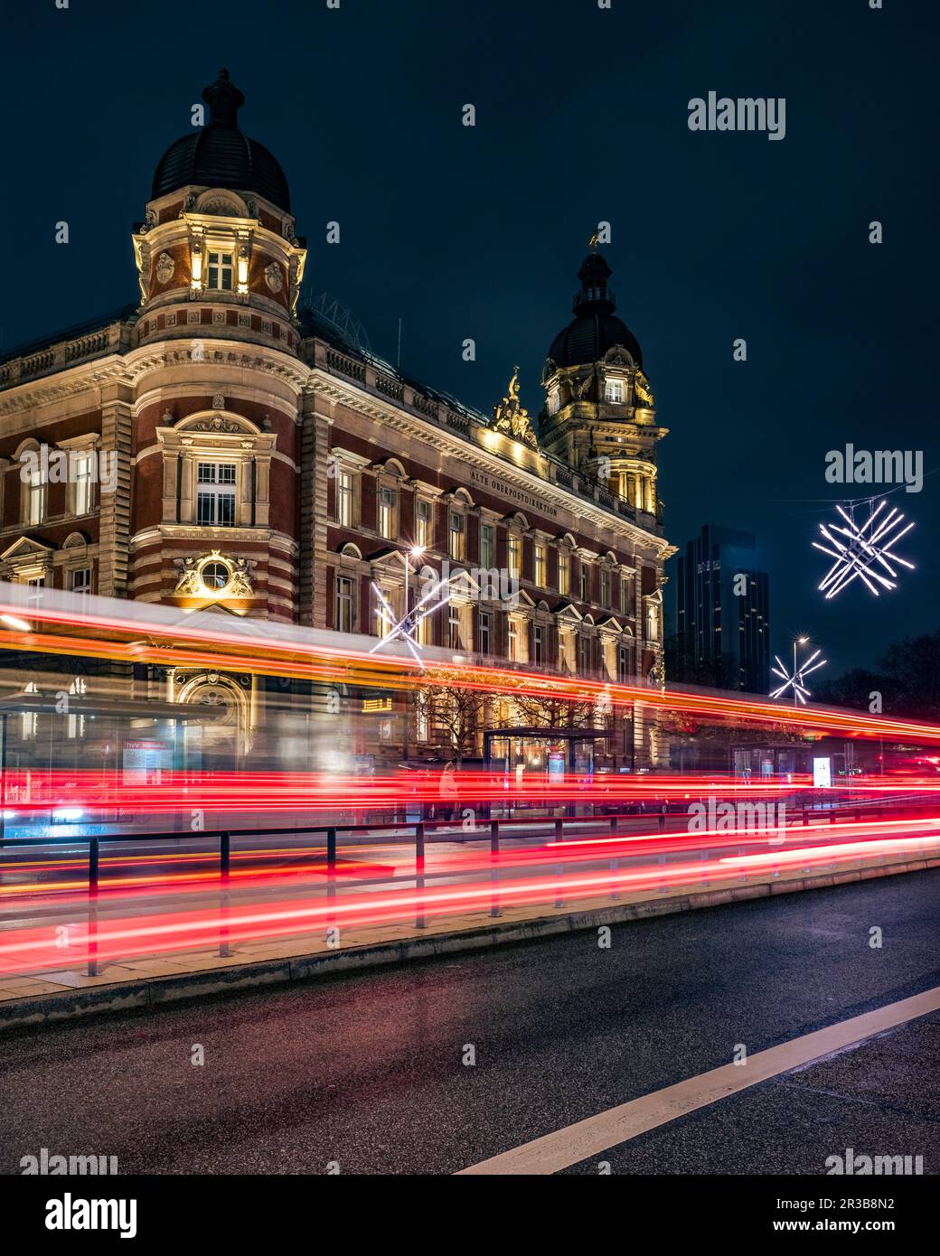 Germany, Hamburg, Vehicle street lights in front of old ...
