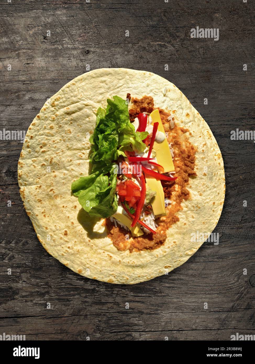 Tortilla wrap with filling Stock Photo - Alamy