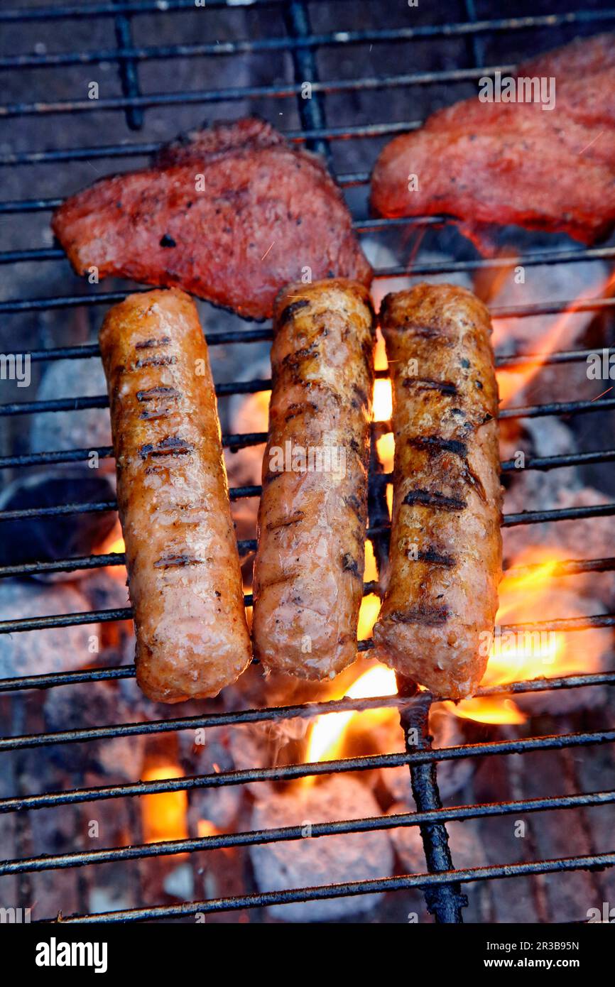 Sausages on grill hi-res stock photography and images - Alamy
