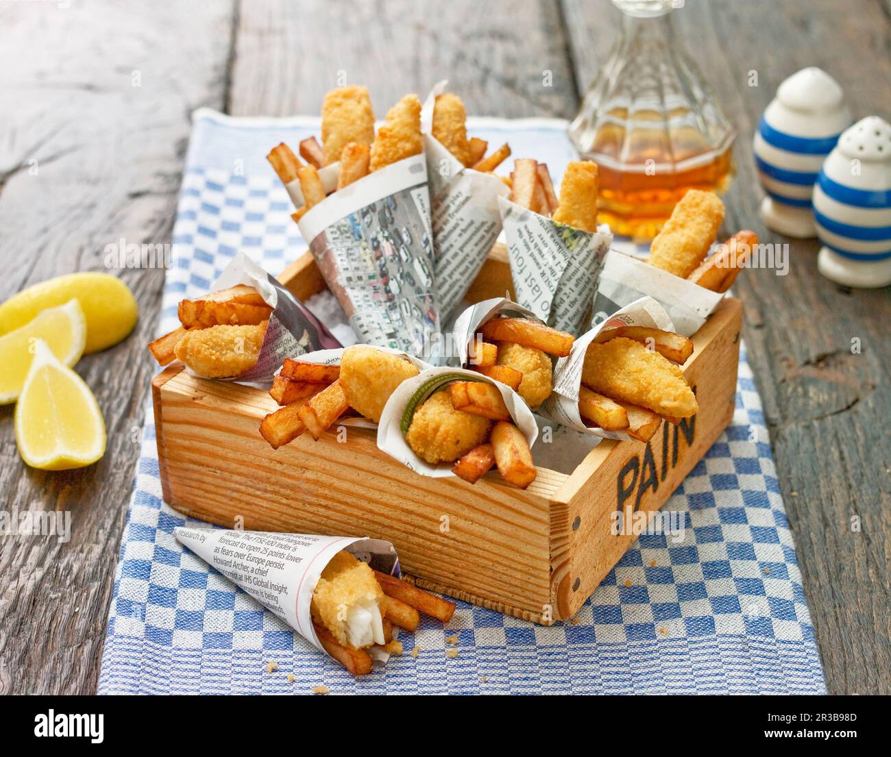 Fish wrapped in newspaper hi-res stock photography and images - Alamy