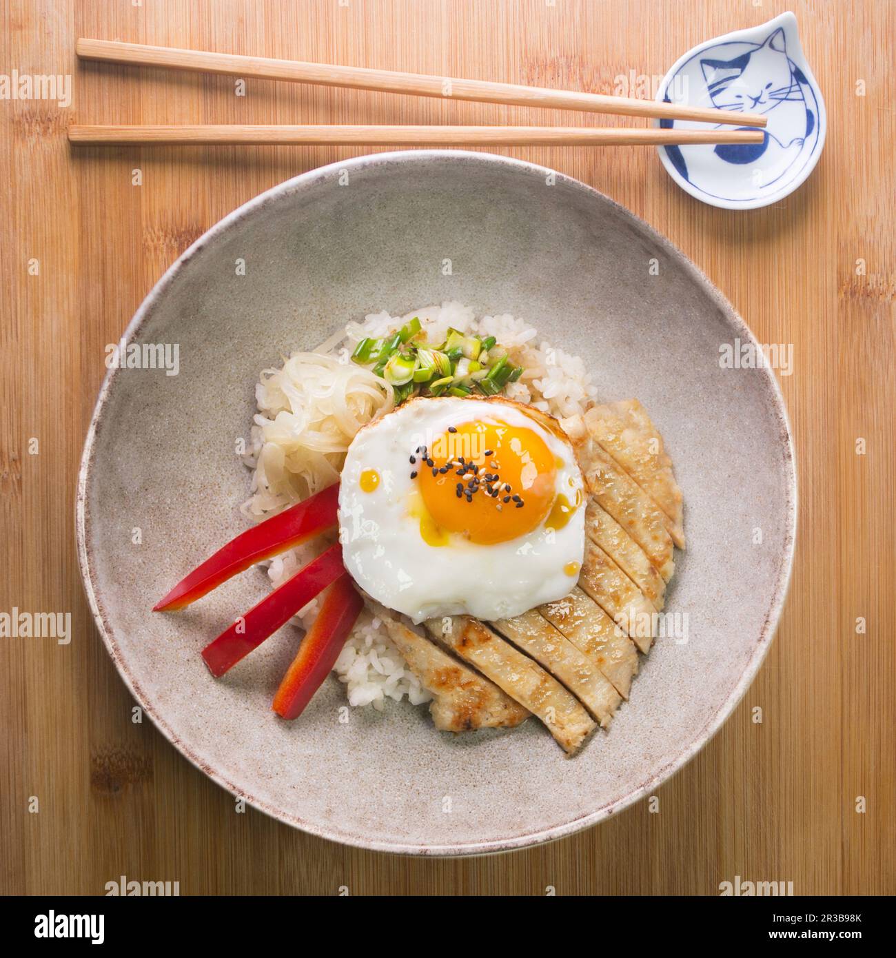 Chicken Donburi with paprika, egg and onion Stock Photo - Alamy