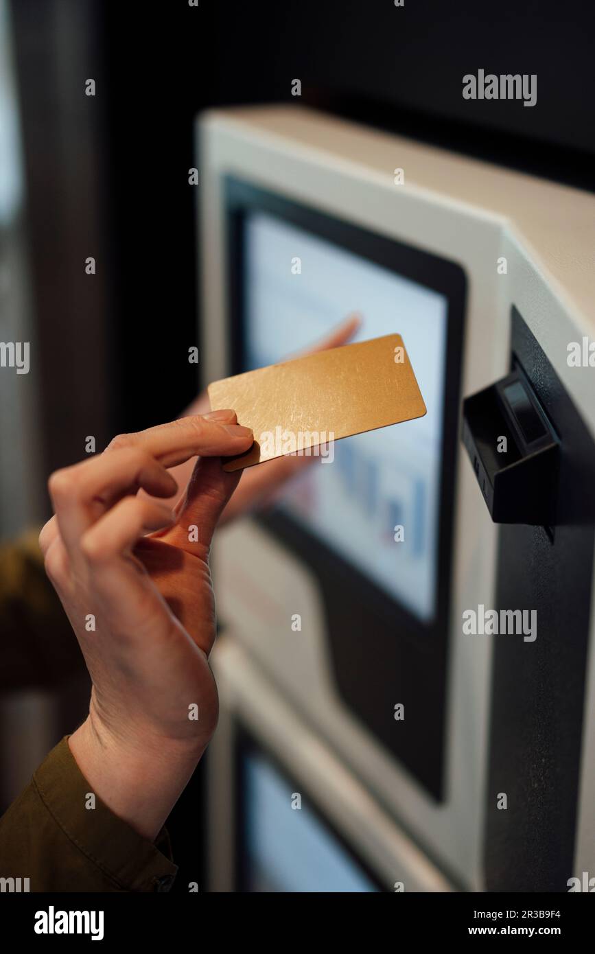 Inserting card in atm hi-res stock photography and images - Alamy
