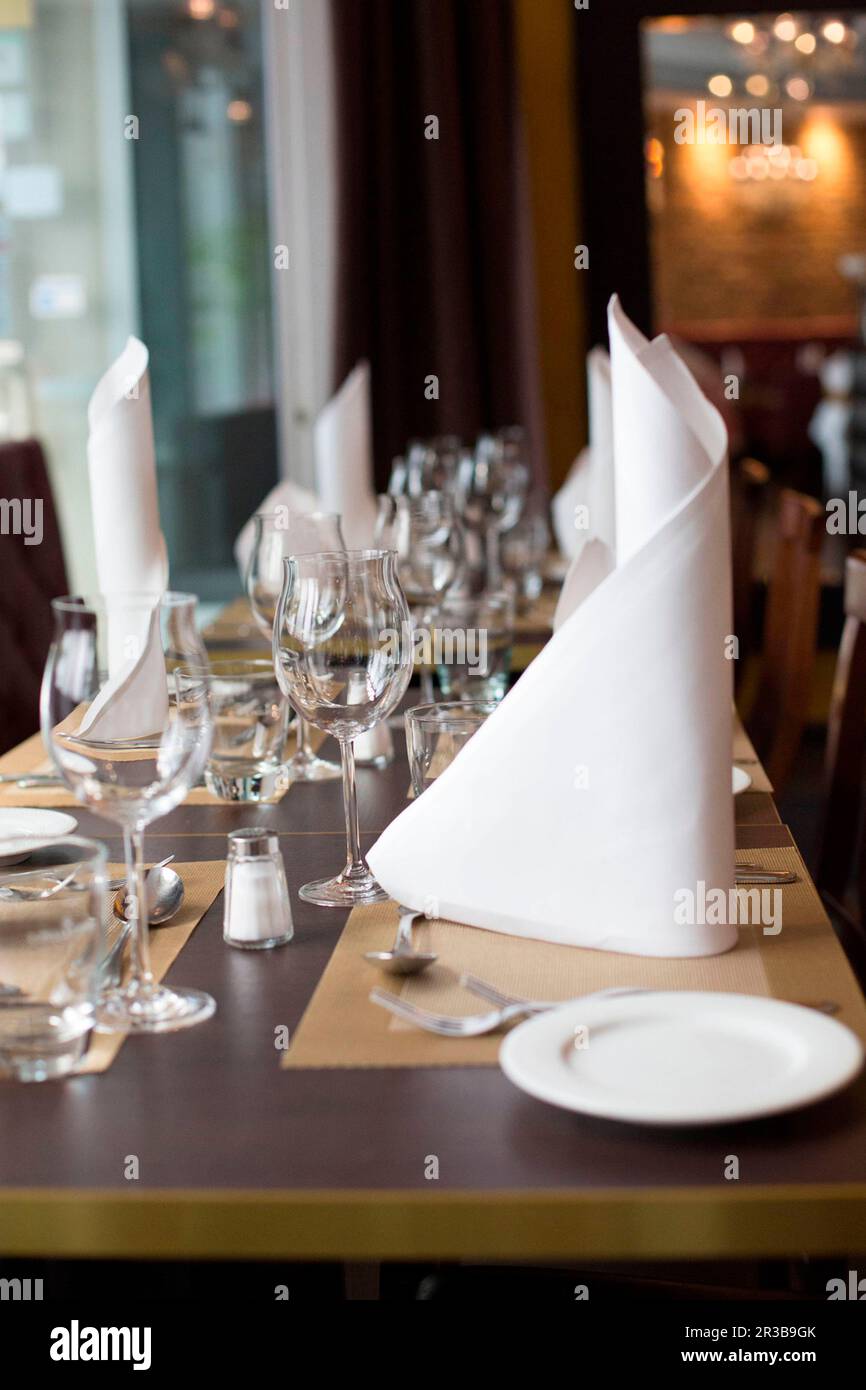 Laid table in restaurant Stock Photo - Alamy
