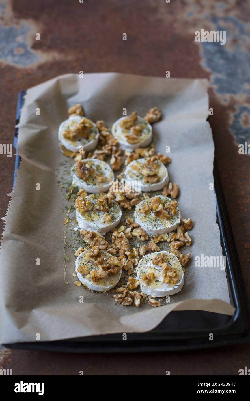 Goat's cheese with honey-glazed nuts Stock Photo - Alamy