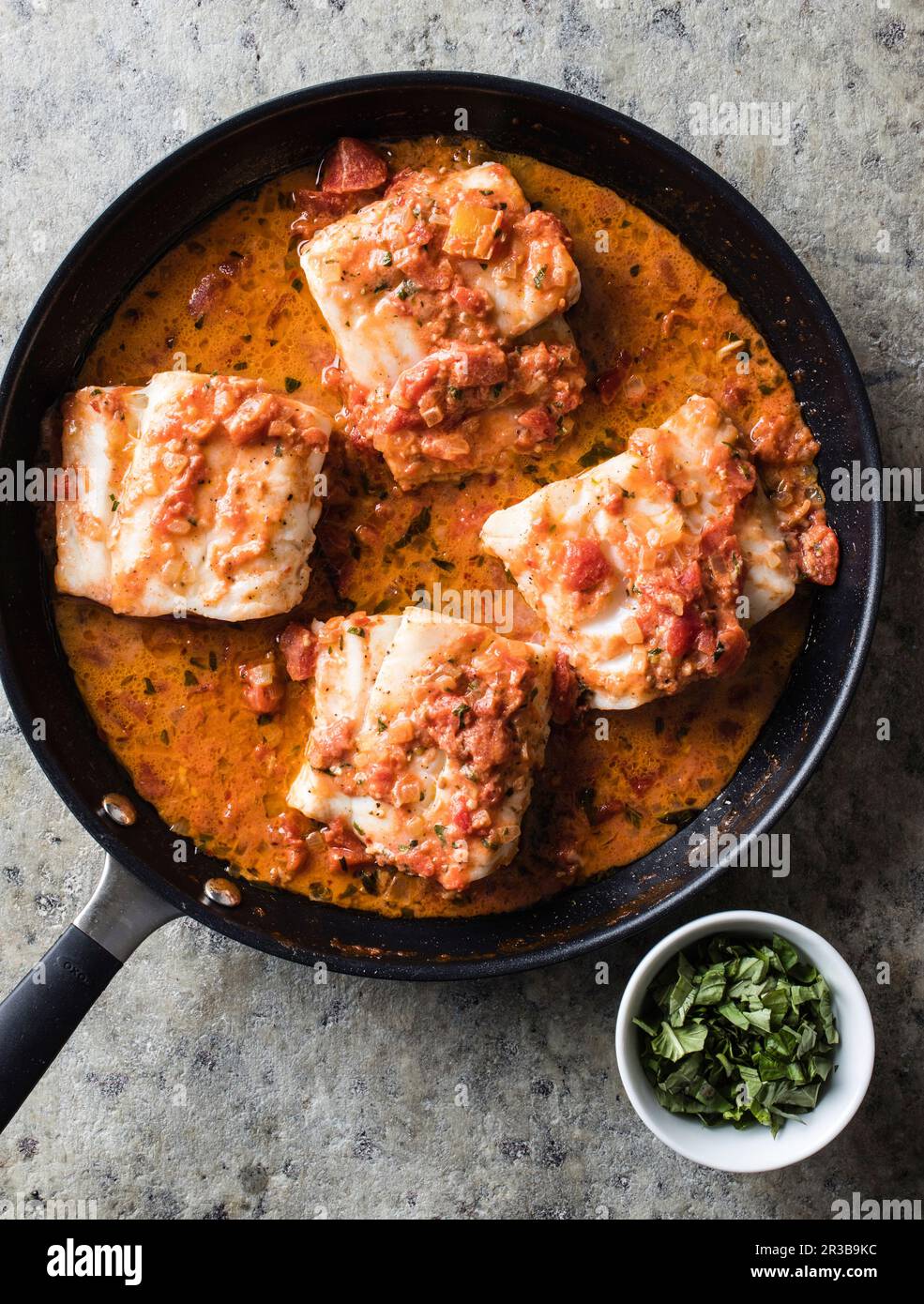 Braised cod pomodoro Stock Photo - Alamy