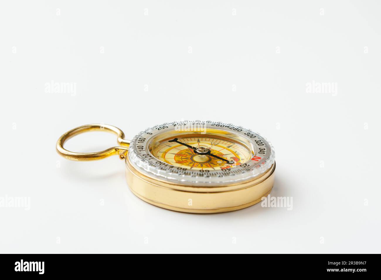 Antique golden compass isolated on white background Stock Photo - Alamy