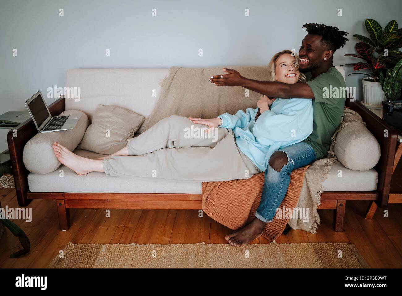 Watching movie sofa hi-res stock photography and images - Alamy