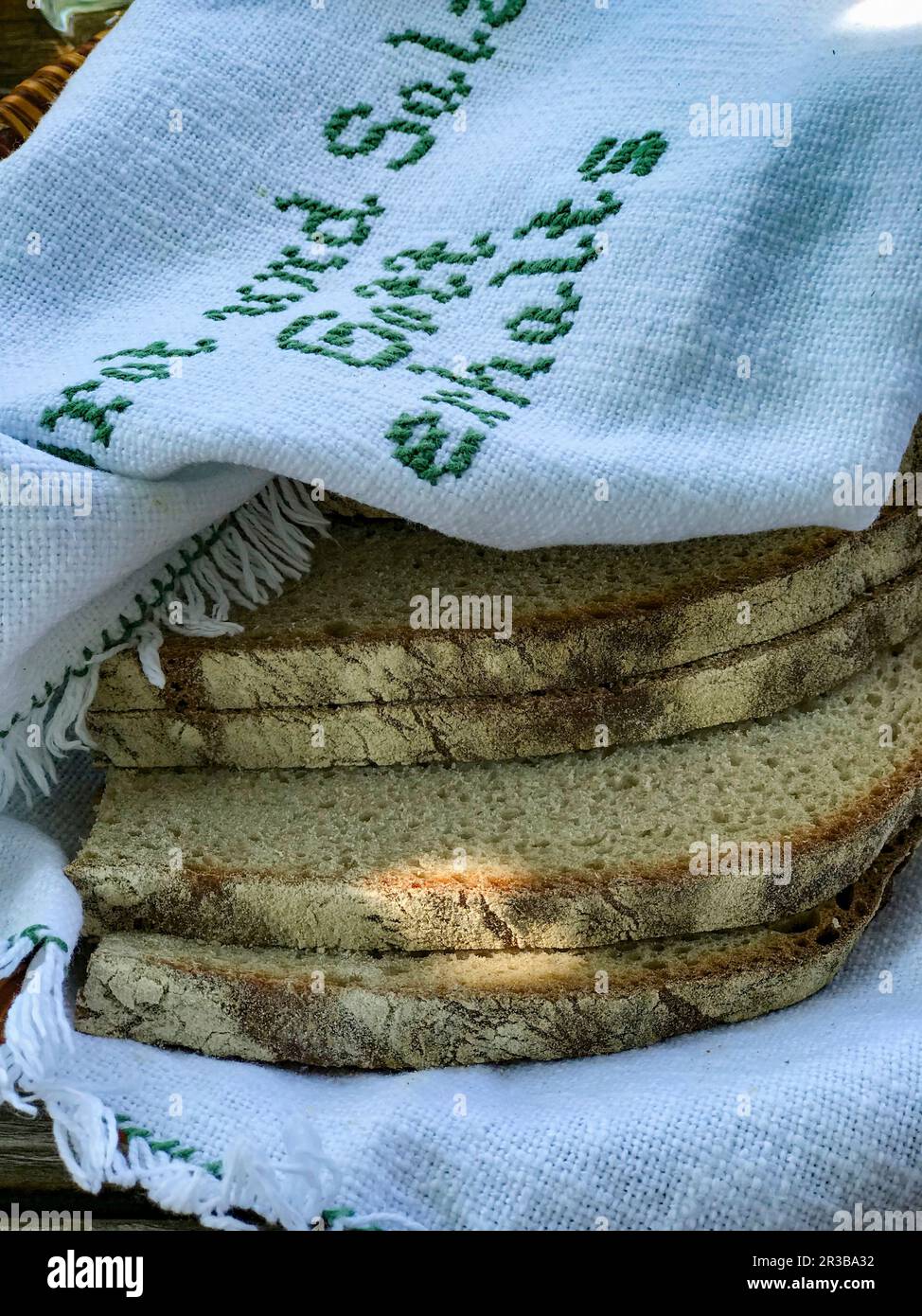 Slices of bread in a linen cloth Stock Photo - Alamy