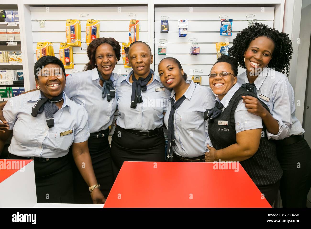 Grocery store staff at local Pick 'n Pay spaza shop Stock Photo - Alamy