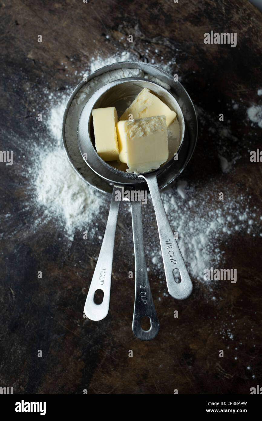 Butter in a measuring cup Stock Photo - Alamy