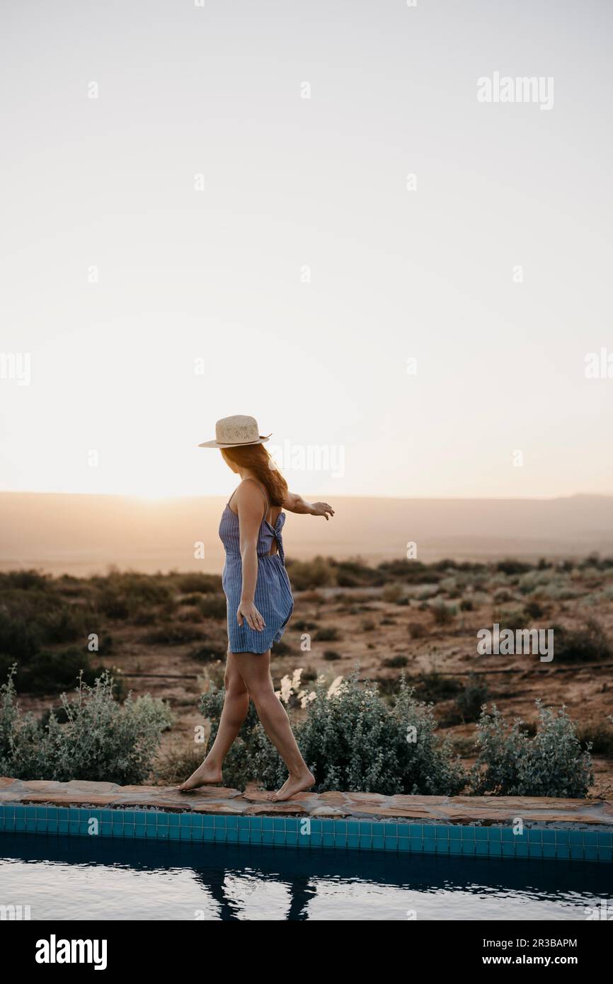 Woman walking swimming pool hi-res stock photography and images - Alamy