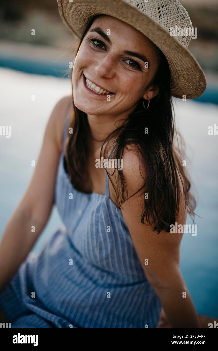 Person sitting by the pool hi-res stock photography and images - Alamy