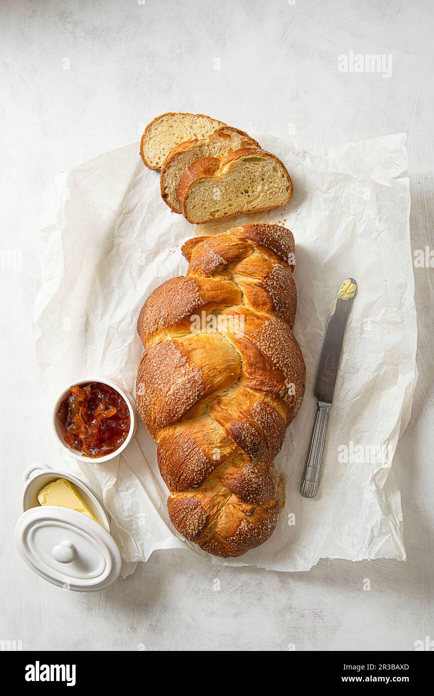 Sweet bread sliced with a pot of marmalade and butter Stock Photo - Alamy