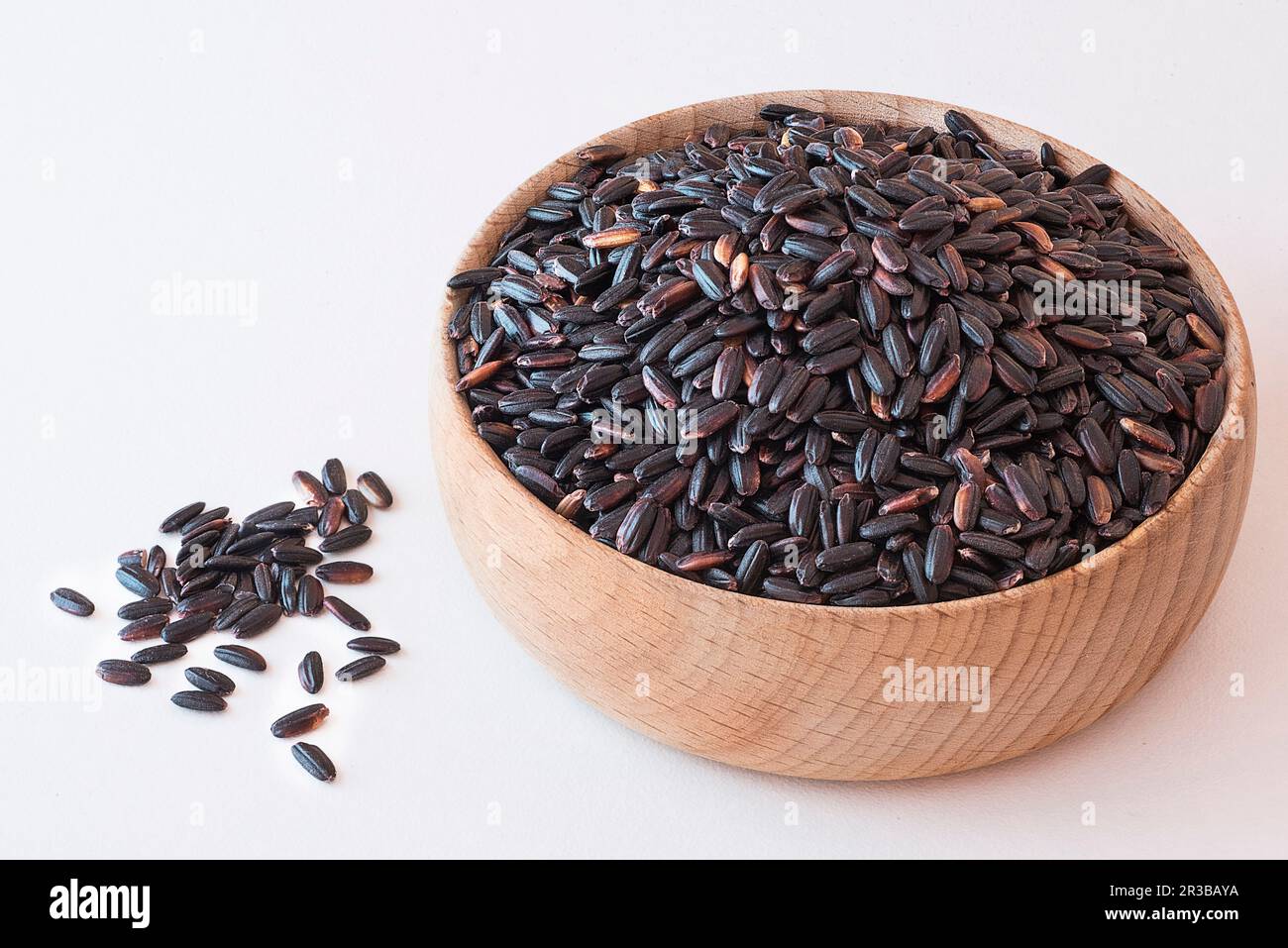 Black venere rice in a wooden bowl on Stock Photo - Alamy
