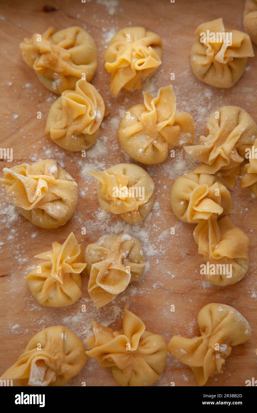 Dumplings on a floured work surface Stock Photo - Alamy