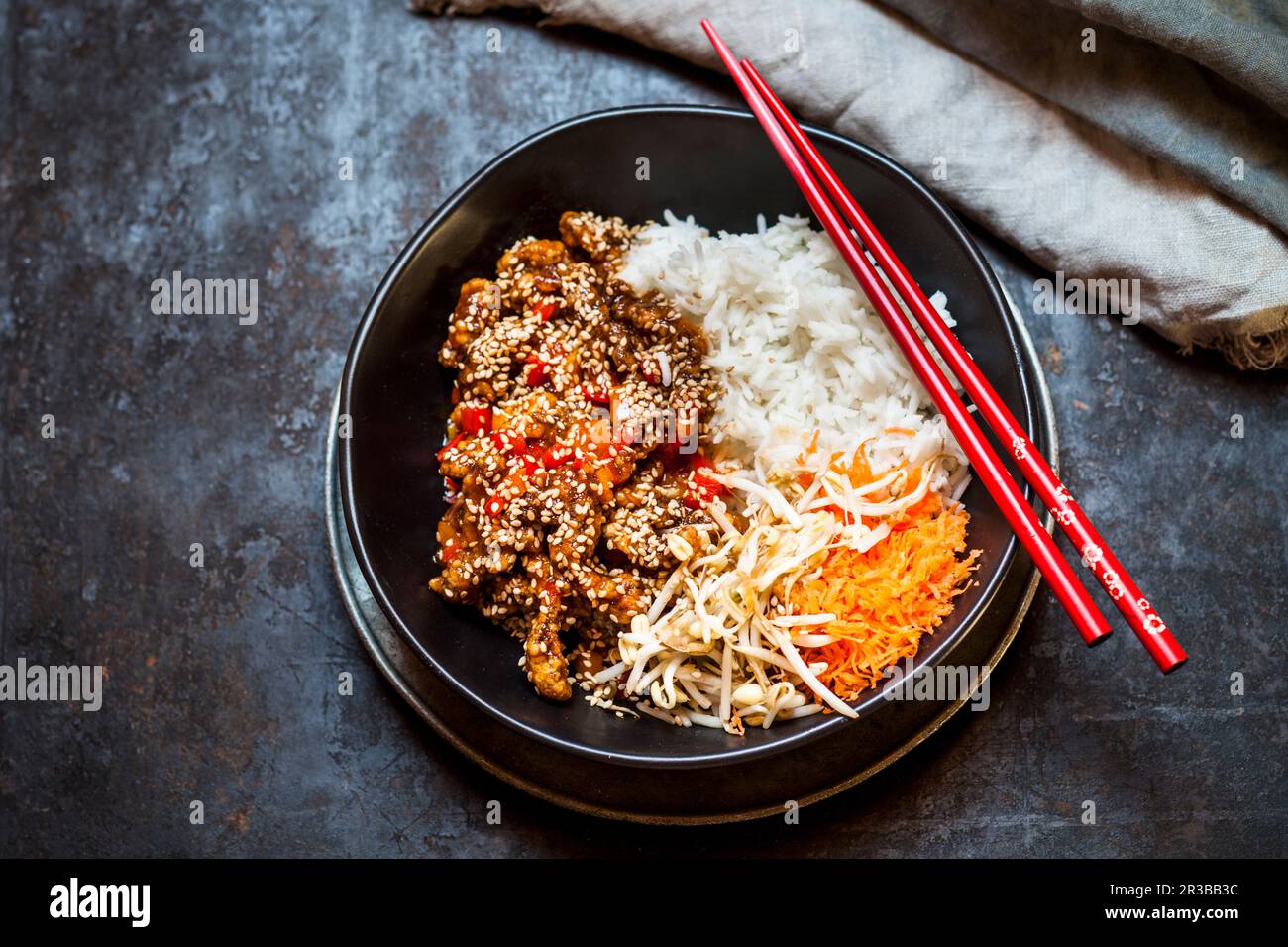 Sticky sesame beef with rice and vegetables Stock Photo - Alamy