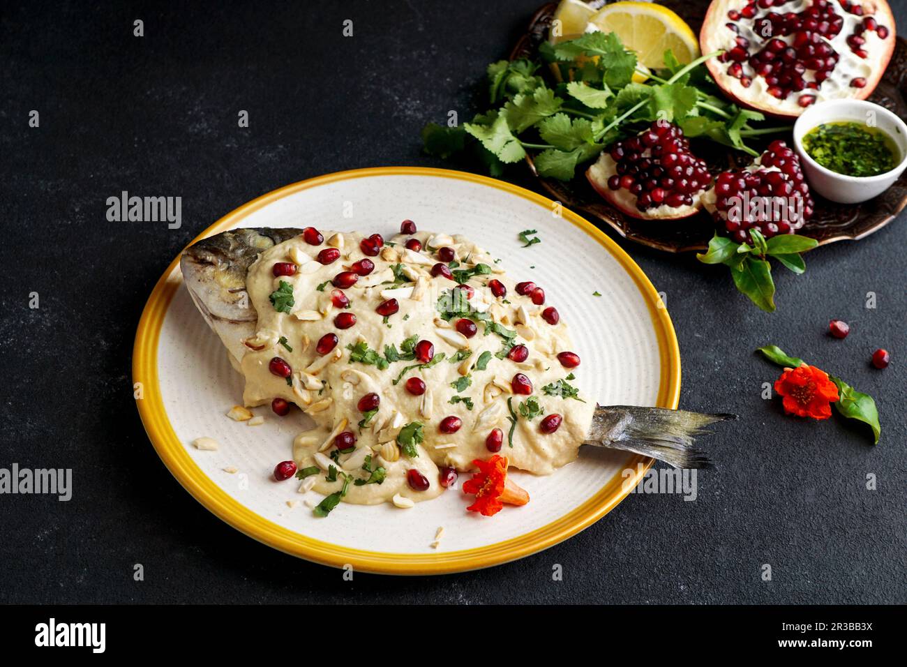 Samke Harra - Lebanese spicy fish with tahini sauce, pomegranate seeds ...