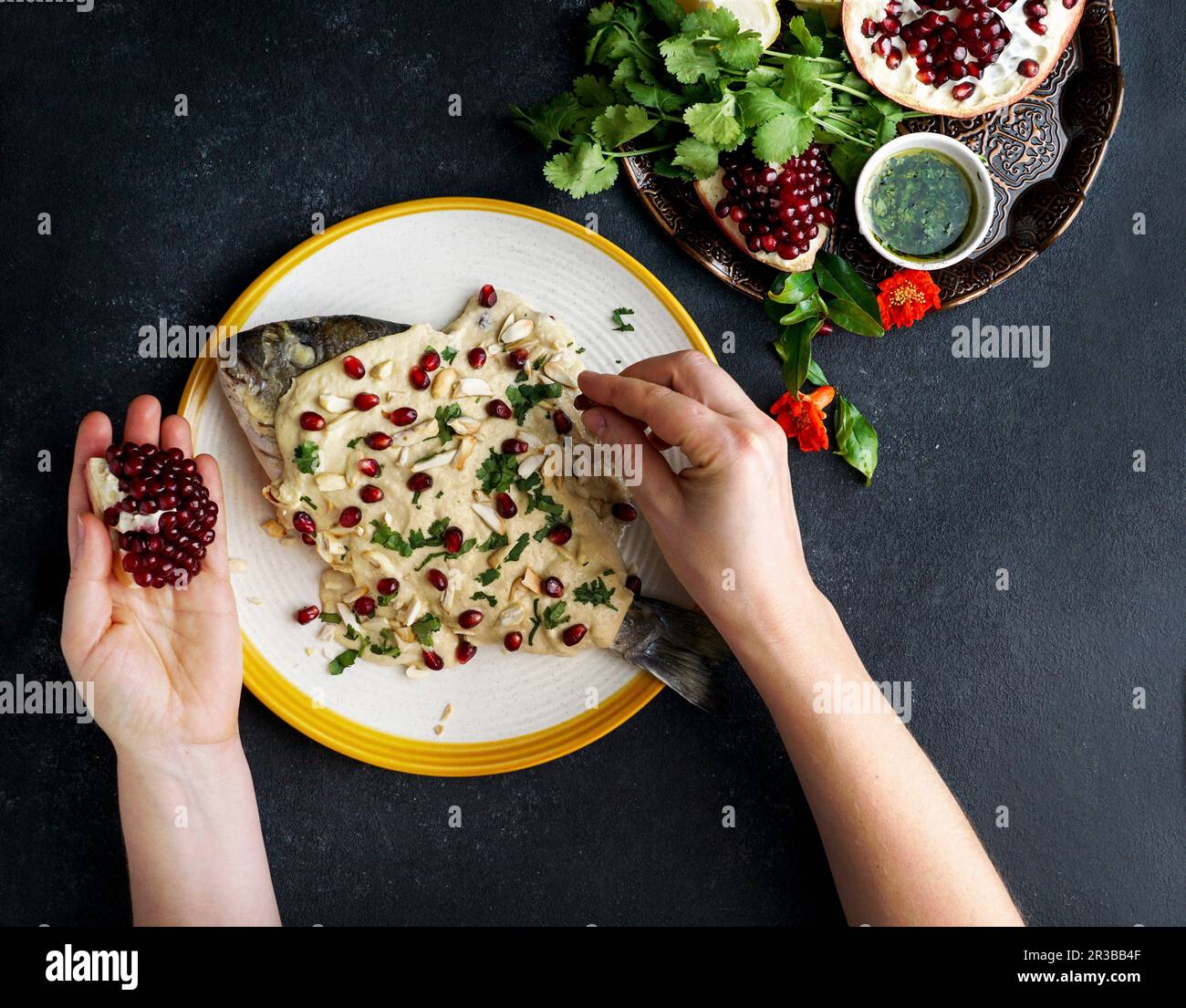 Samke Harra - Lebanese spicy fish with tahini sauce, pomegranate seeds ...