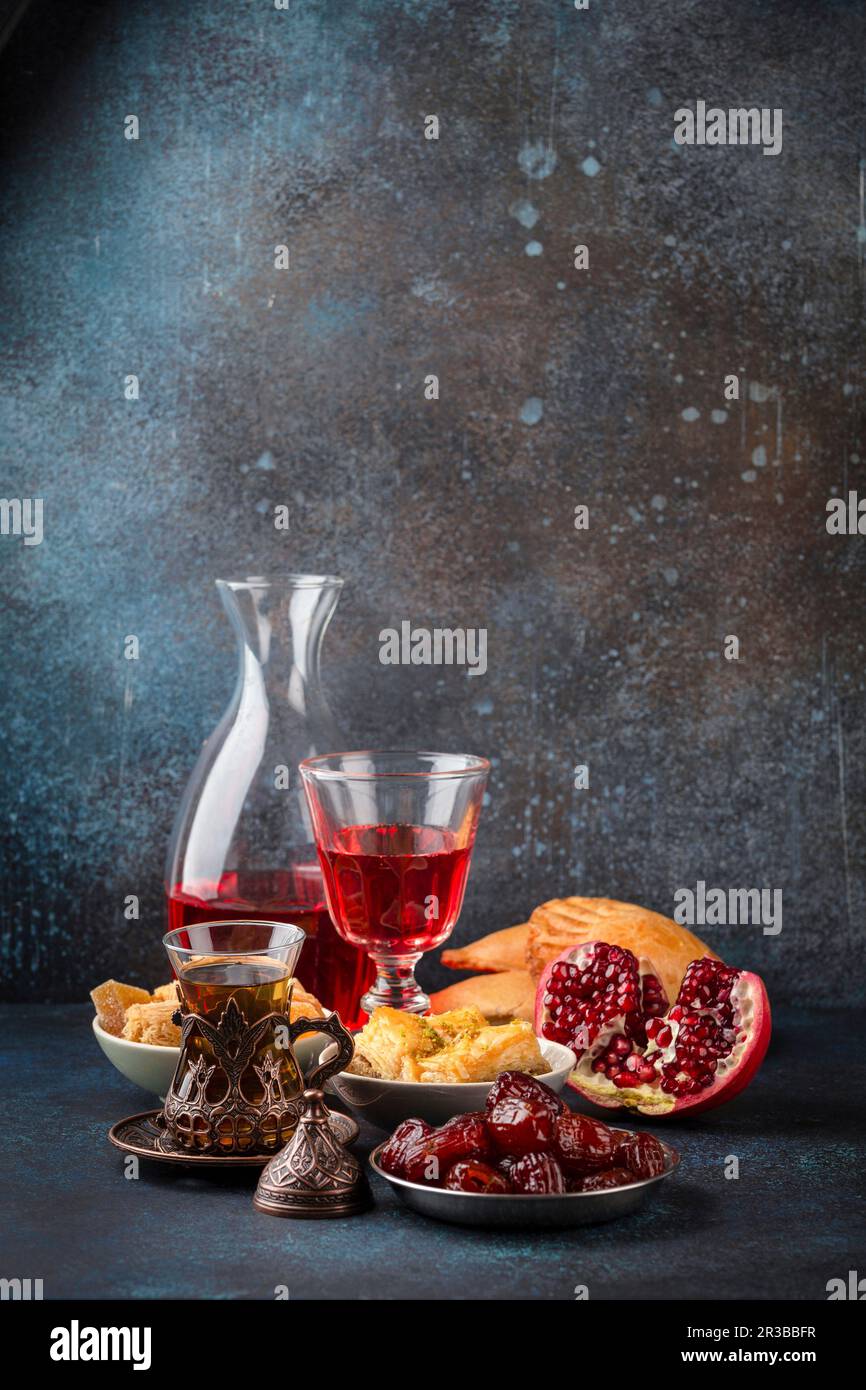 Ramadan kareem Iftar meal with dates, baklava, traditional Arabic ...