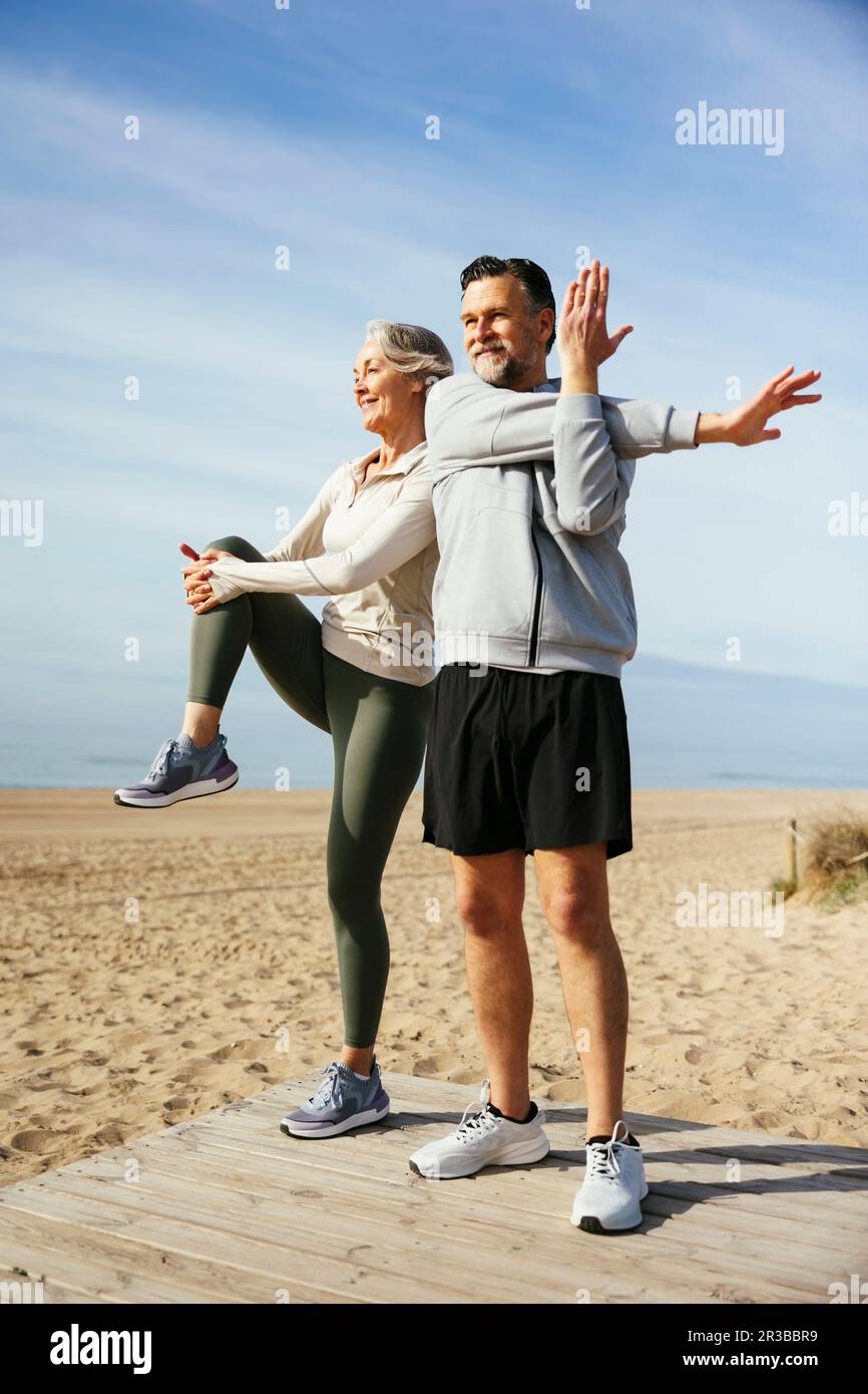 Woman man stretching outdoors hi-res stock photography and images - Alamy