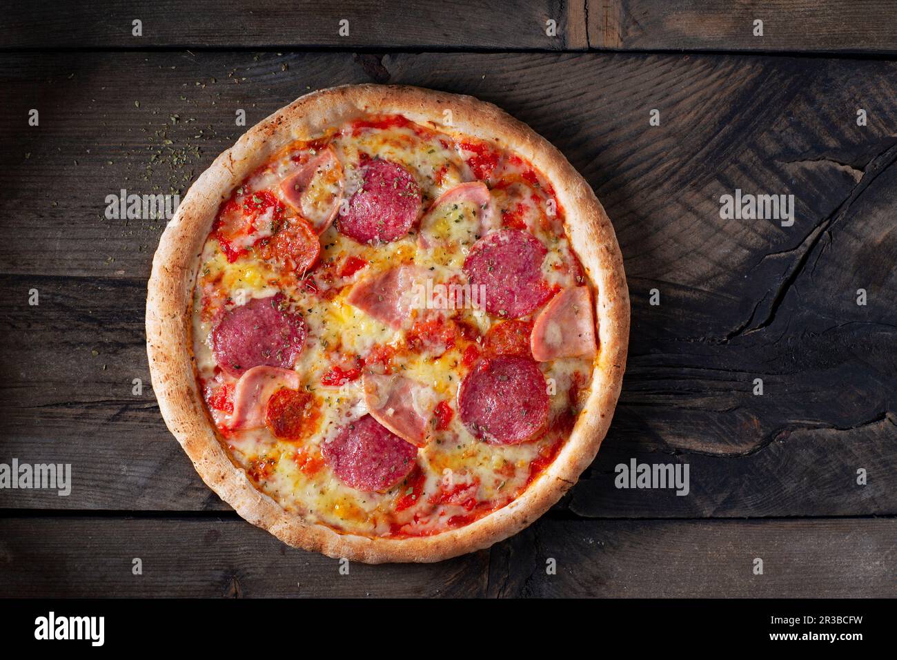 Pizza with salami, chorizo and ham Stock Photo - Alamy