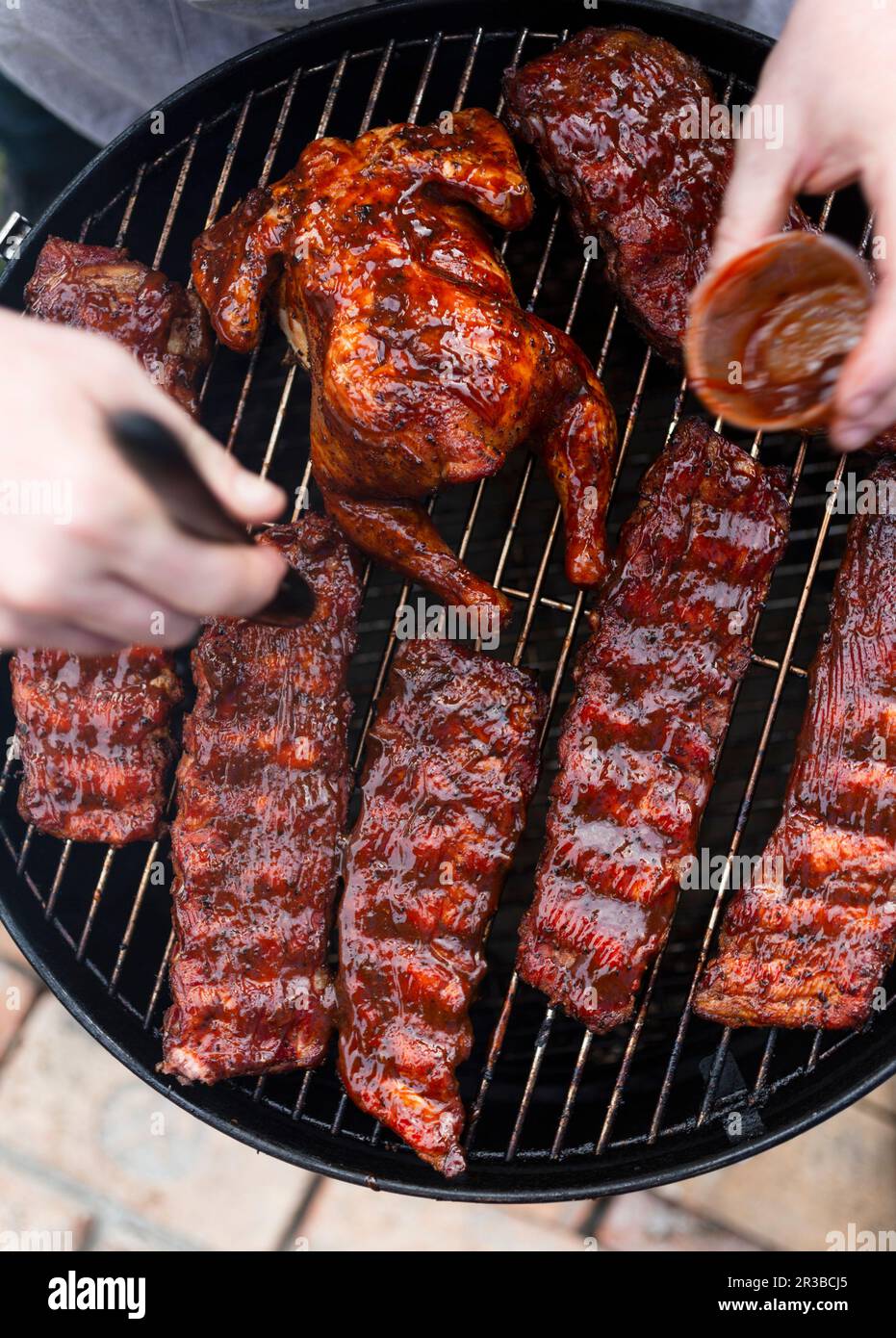 Beef bbq ribs and chicken with bbq sauce Stock Photo - Alamy