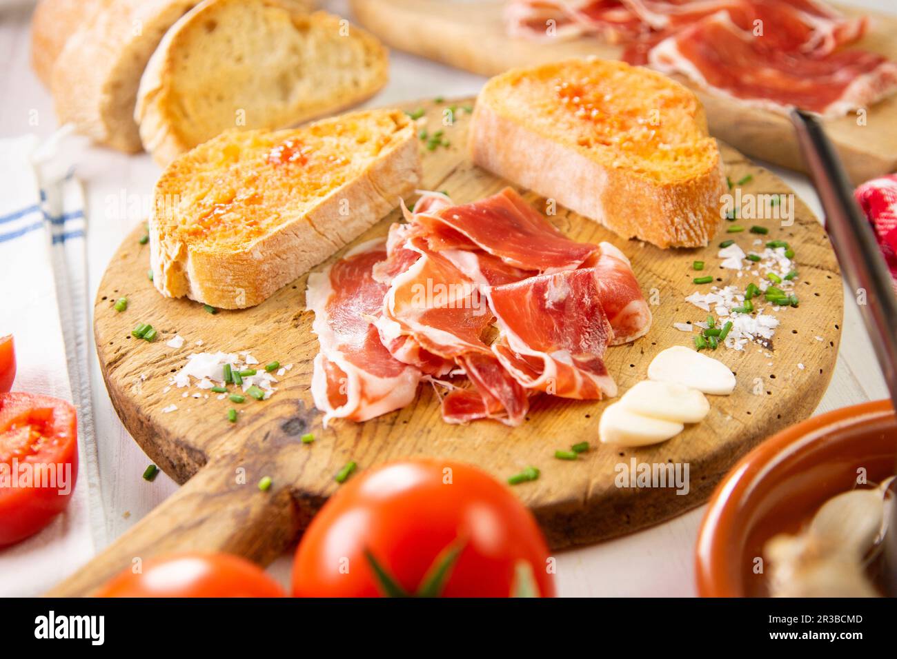 Ibèrico ham, served with traditional 'Pà amb tomaquet' Stock Photo - Alamy