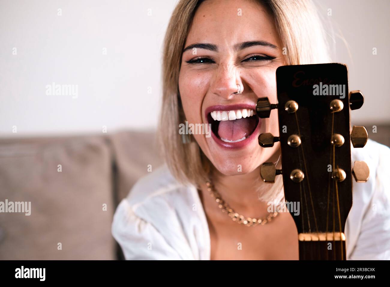 Blond guitar hi-res stock photography and images - Alamy