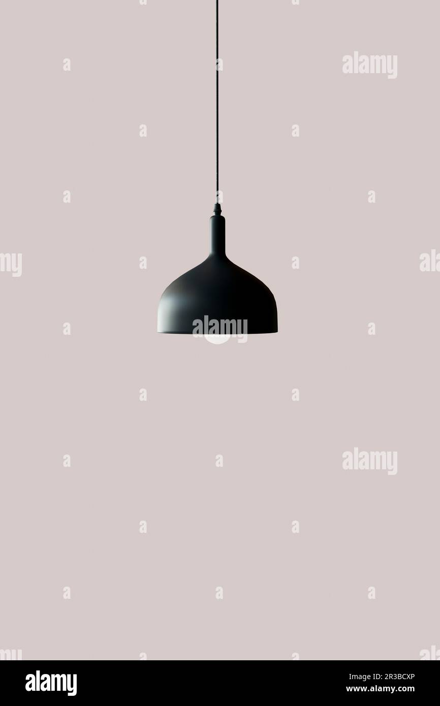 3D render of single black light fixture hanging against pink background ...