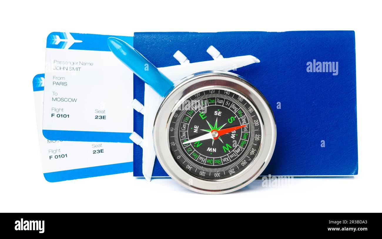 Flight tickets and compass isolated on white background close up Stock ...