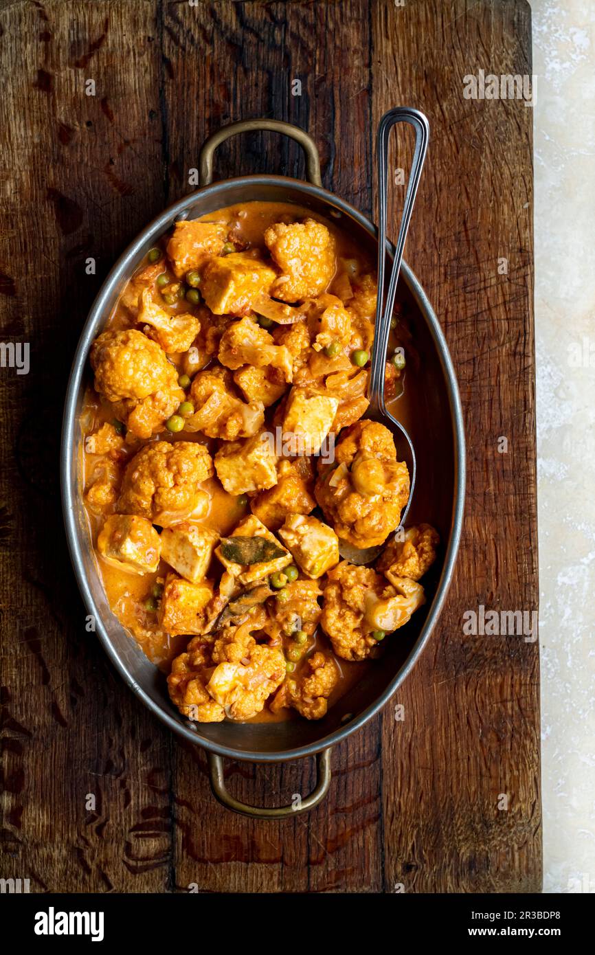Matar Paneer with Cauliflower and Butter Naan Stock Photo - Alamy