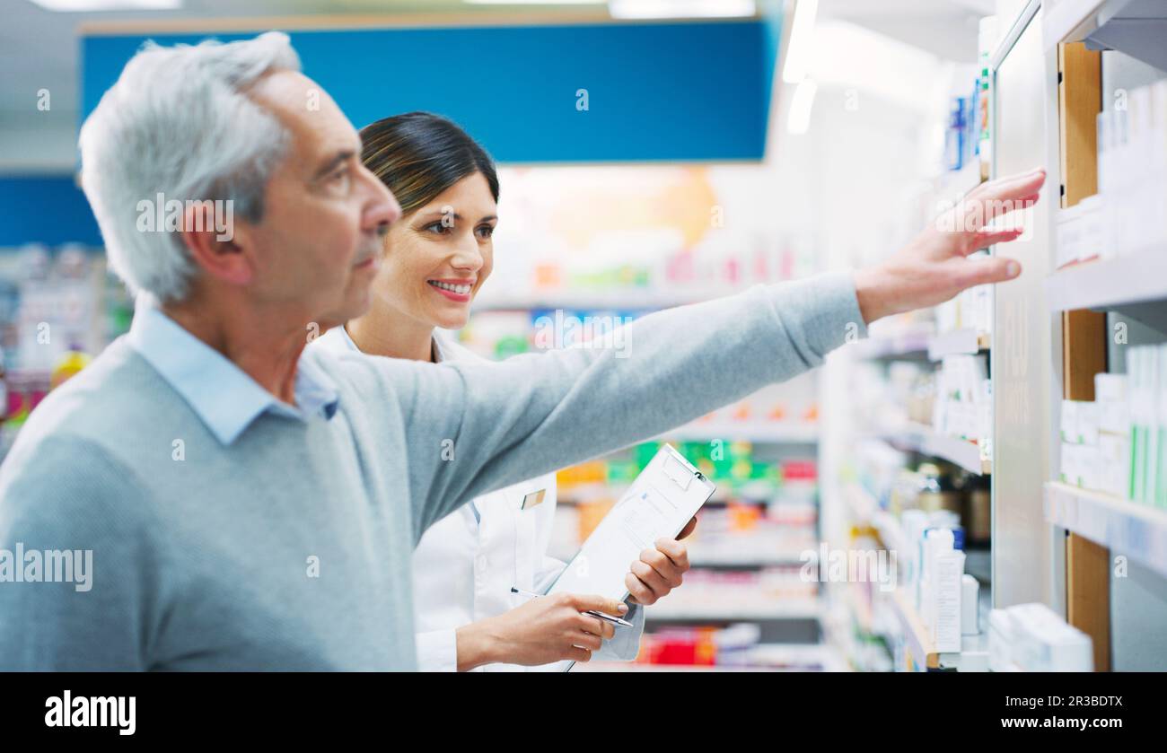 Store shelf, senior customer and pharmacy woman, advice and ...