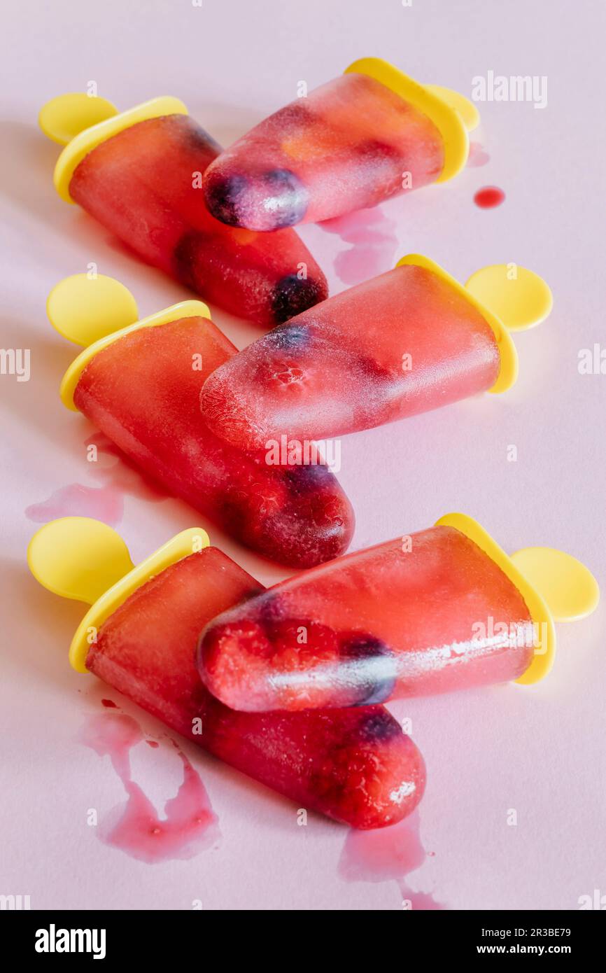 Frozen juice ice cream with raspberries and blueberries Stock Photo - Alamy